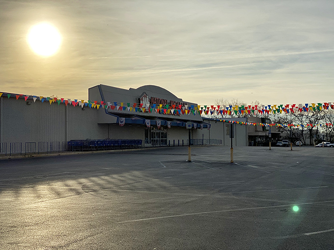 Sunset shopping has its own magic. The colorful pennant flags flutter in the breeze, beckoning deal-seekers like a carnival of savings.