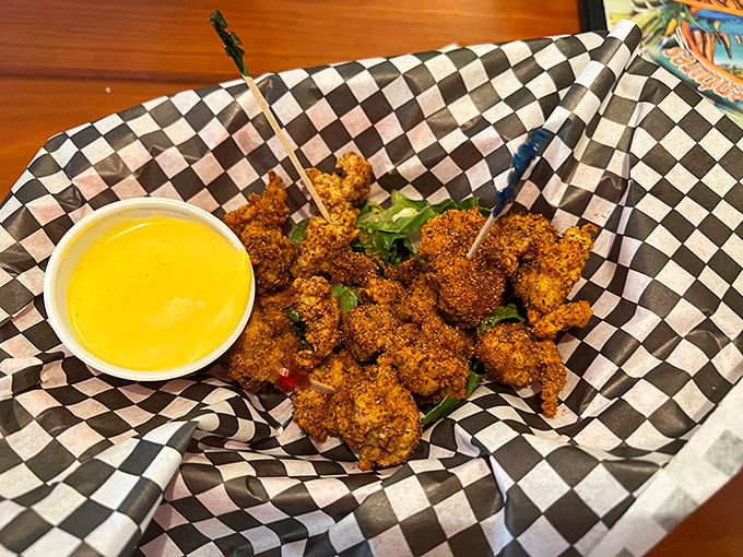 Gator bites arrive golden and crispy, served with a sunny dipping sauce. It's the ultimate Florida handshake&mdash;nice to eat you!
