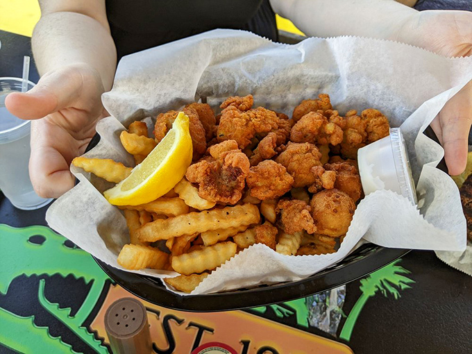 Golden-brown nuggets of happiness! These fried shrimp baskets have launched road trips from every corner of Florida – that lemon wedge isn't just garnish, it's essential.