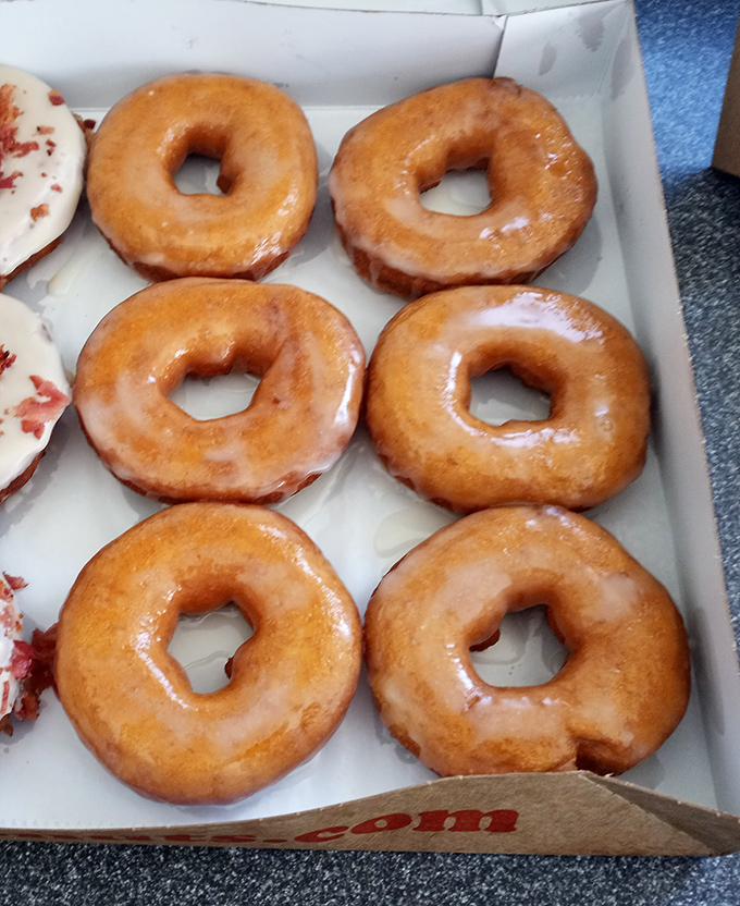 Classic glazed donuts &ndash; the little black dress of the pastry world. Simple, elegant, and always the right choice for any occasion.