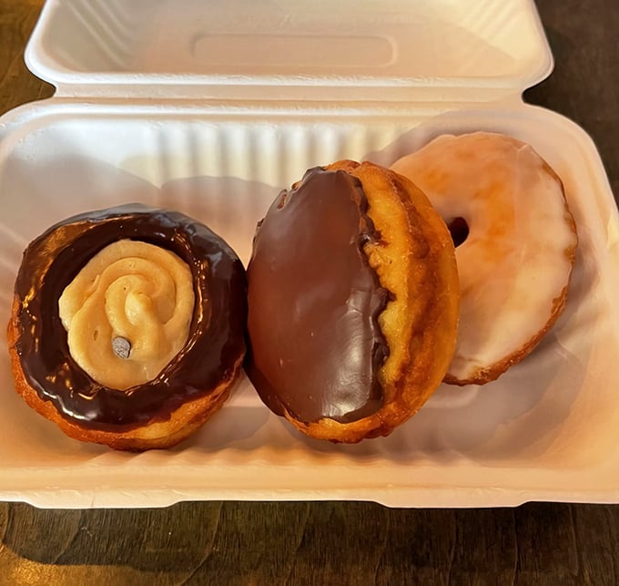 These aren't just donuts, they're edible works of art. The chocolate-dipped masterpiece with peanut butter filling would make Elvis himself weep with joy.