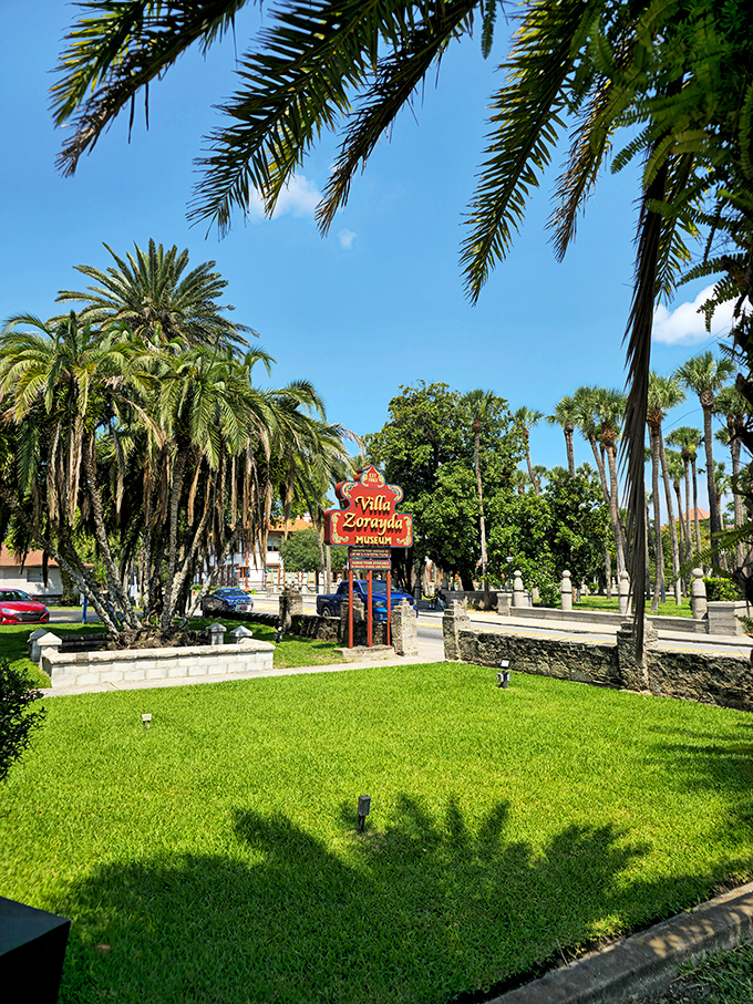 Even the grounds maintain the exotic illusion&mdash;lush Florida greenery surrounding that iconic red sign, as if Granada and St. Augustine had a beautiful architectural baby.