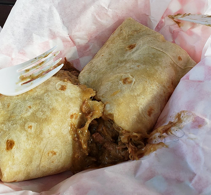 The legendary Green Chili Burrito in its natural habitat &ndash; about to disappear. That tortilla is holding more flavor than should be legally possible.