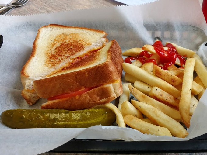 The holy grail of comfort food&mdash;golden-brown perfection with melty American cheese. This isn't just a grilled cheese sandwich; it's edible nostalgia served with a pickle.