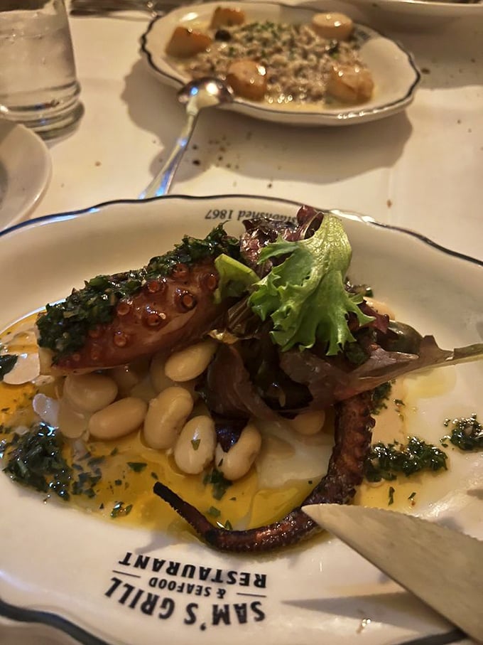 This octopus isn't just grilled, it's transformed. Nestled among white beans and dressed with herbs, it's seafood that demands your full attention.