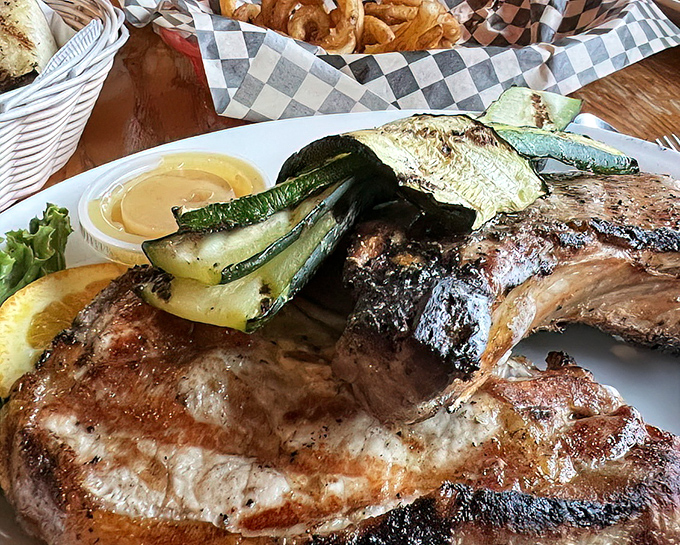 This pork chop has the kind of char marks that would make a professional grill master weep with joy. The zucchini is just showing off.