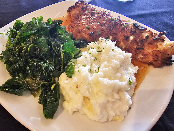 This isn't just fish&mdash;it's a masterclass in simplicity. Perfectly seasoned grouper with creamy mashed potatoes and saut&eacute;ed spinach that would make Popeye weep.