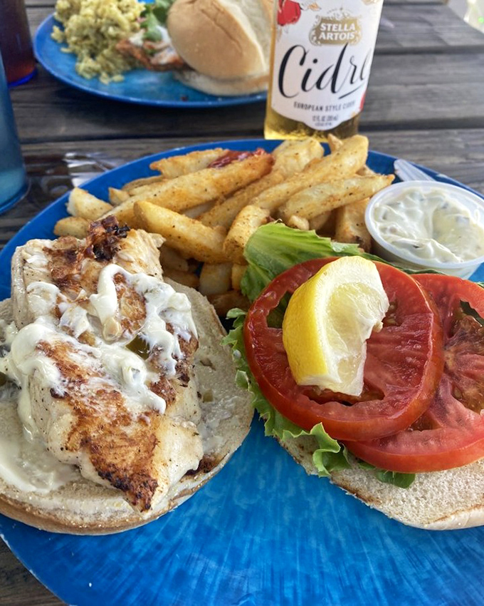 Sandwich perfection doesn't exi&mdash; Oh wait, it does! Grilled fish, fresh tomato, crispy fries, and that sauce&hellip; this is what vacation memories are made of.