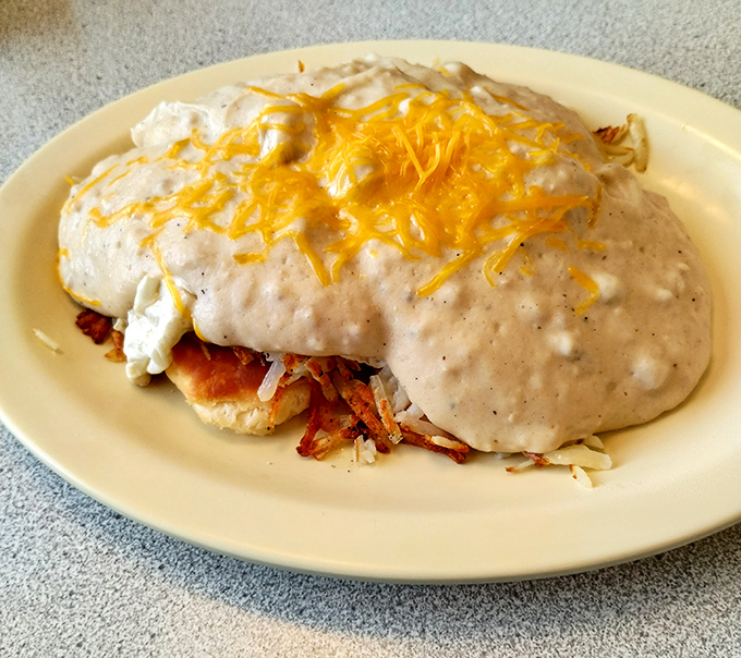 This isn't just breakfast&mdash;it's a gravity-defying monument to morning indulgence, where gravy and cheese create a delicious avalanche of flavor.