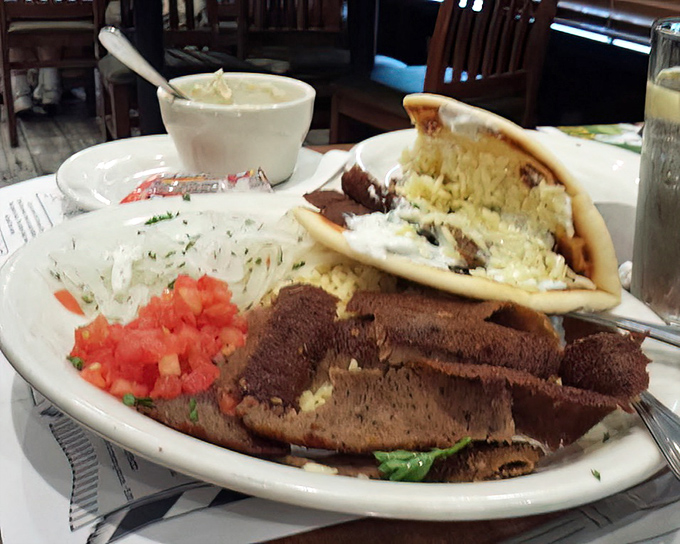 Behold the gyro in its natural habitat&mdash;seasoned meat, fresh veggies, and tzatziki sauce creating that perfect harmony worth driving to Surprise for.