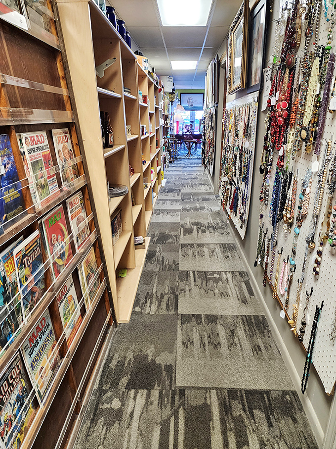Magazine racks meet jewelry displays in this narrow passage to the past. The treasure hunt begins with just one step down this rabbit hole.