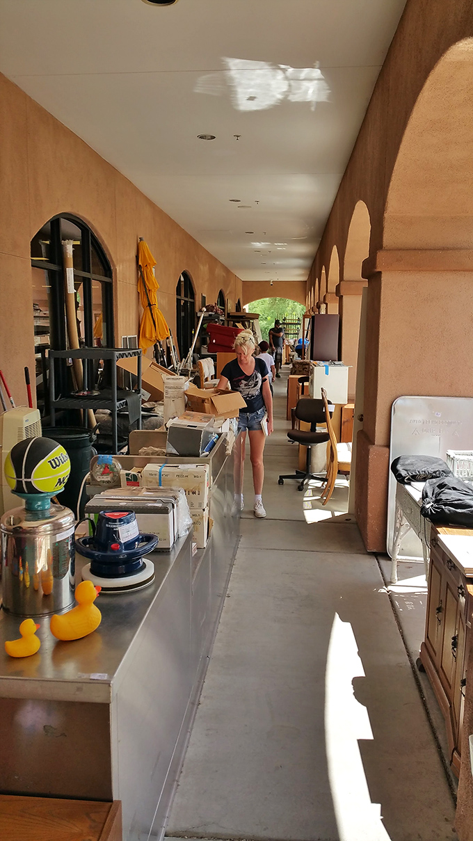 Thrift store hallways: where rubber duckies and office chairs coexist in perfect harmony, waiting for their second chance at usefulness.