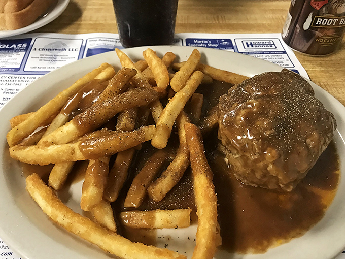 The legendary hamburger steak in all its gravy-soaked glory. This isn't just dinner; it's a warm hug on a plate that makes you forget your troubles.