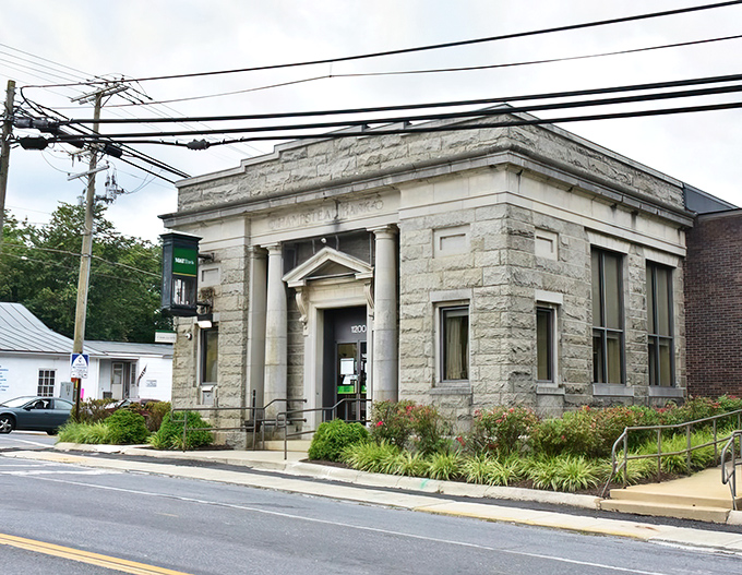 This stately stone bank building stands as Hampstead's architectural crown jewel &ndash; when banks were built to inspire confidence, not just house ATMs.