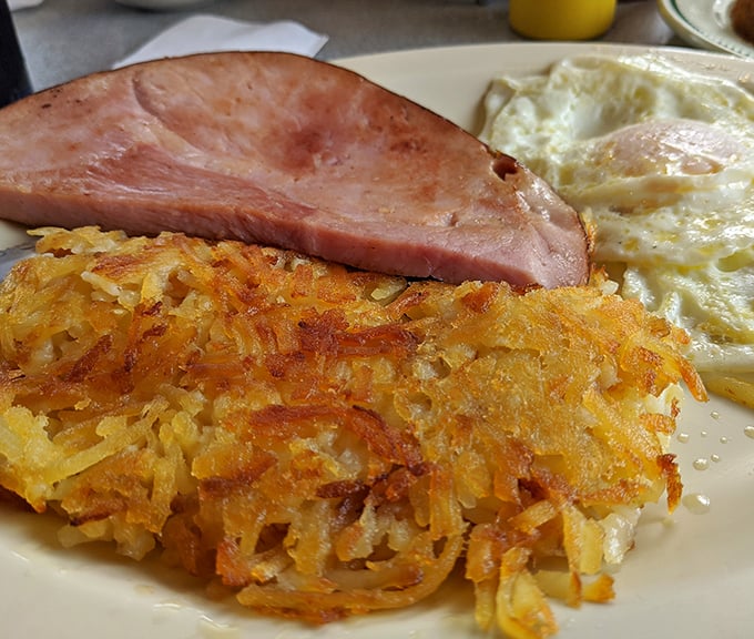 These hash browns achieve the impossible trifecta: crispy exterior, tender interior, and that perfect golden hue. The breakfast equivalent of winning the lottery.