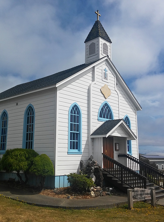 Holy Trinity Church stands as Trinidad's picture-perfect postcard moment. That blue trim against white clapboard? Architectural perfection with a spiritual view.