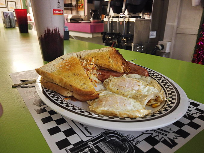 A homestyle breakfast platter featuring two sunny-side-up eggs that look you straight in the eye and say, &ldquo;Good morning, sunshine!&rdquo; Paired with golden toast boasting the perfect butter-to-crunch ratio.
