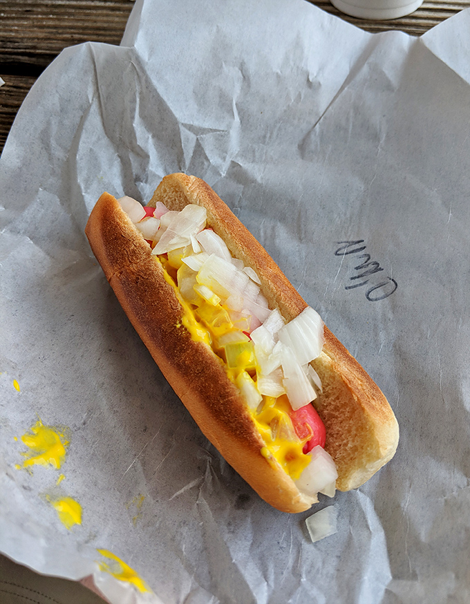 Hot dog perfection doesn't need fancy toppings&mdash;just the right balance of snap, softness, and that signature yellow mustard that somehow tastes better here than anywhere else.