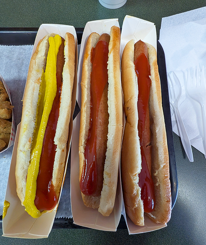 Hot dogs in their natural habitat&mdash;simple, unadorned, and ready for their close-up. That mustard line is applied with the precision of a Renaissance painter. 