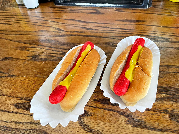 Bright red dogs nestled in soft buns with a squiggle of mustard&mdash;proof that sometimes the simplest pleasures are the most satisfying.