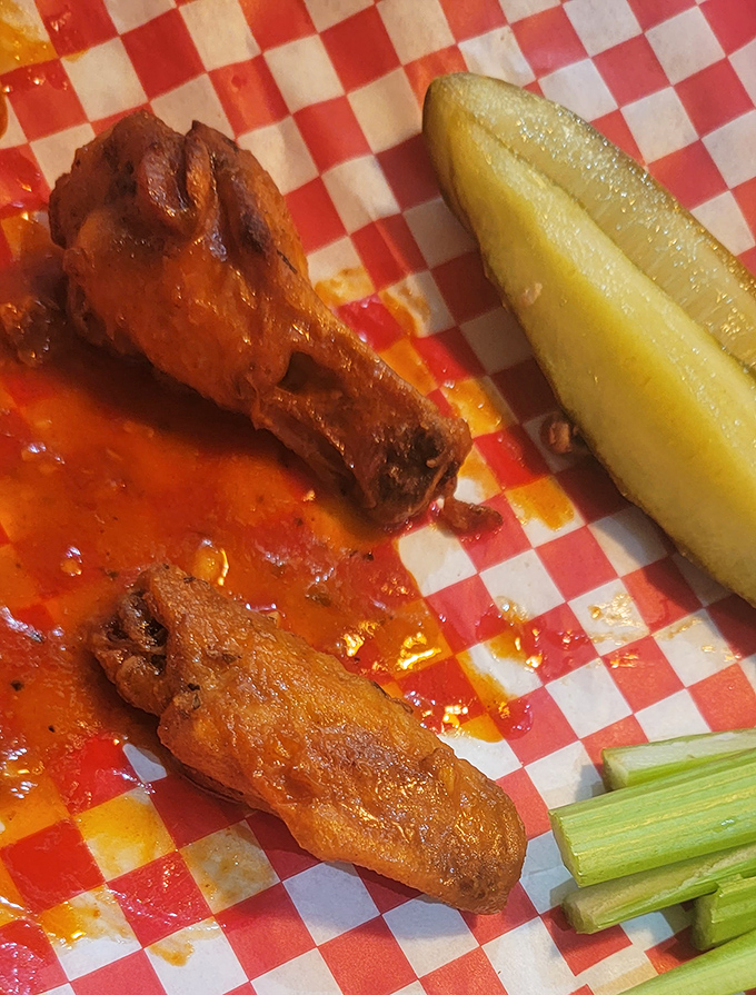 Buffalo wings with attitude, served with the obligatory pickle and celery. Because vegetables make fried food a balanced meal, right?