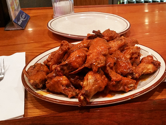 These hot wings aren't just good&mdash;they're "cancel-your-afternoon-plans" good. Glistening with sauce and perfectly crisp, they're what napkins were invented for.