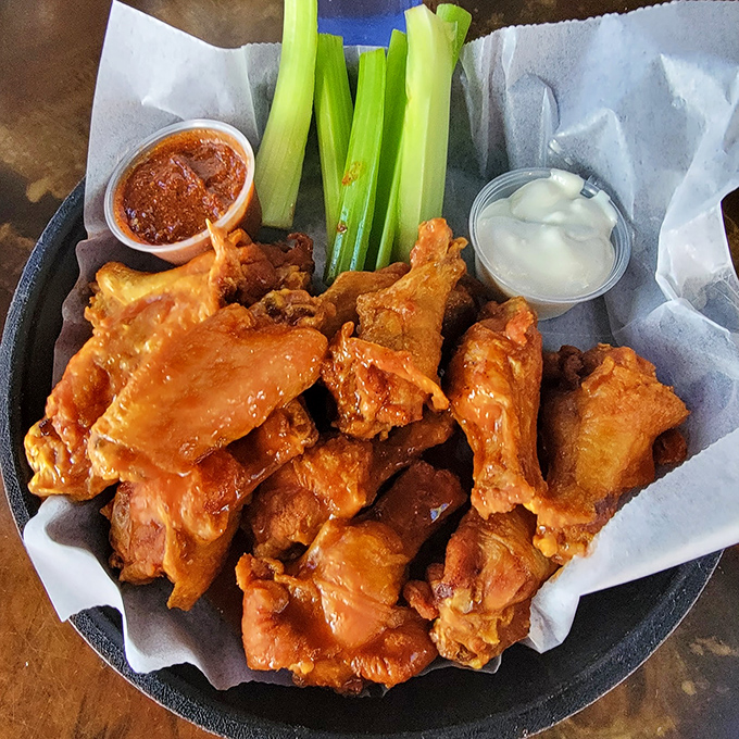 These wings aren't just served; they're presented like the culinary celebrities they are. Crispy, saucy, and ready for their close-up.