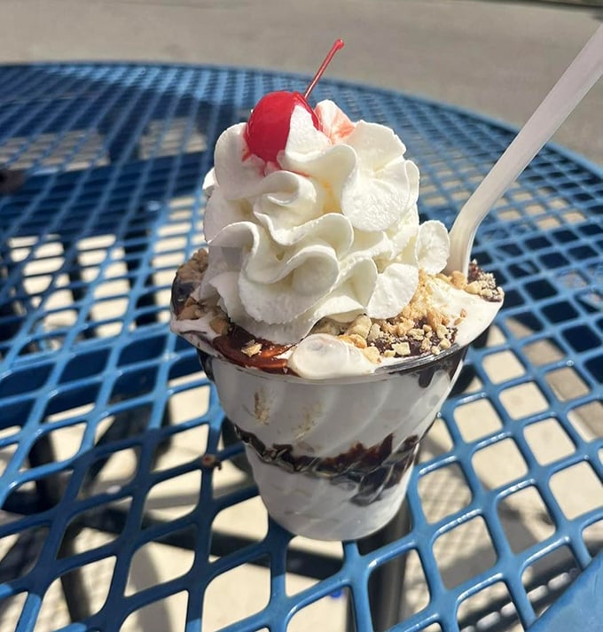 This isn't just a sundae; it's an architectural marvel of whipped cream, hot fudge, and nuts that demands to be admired before it's devoured.