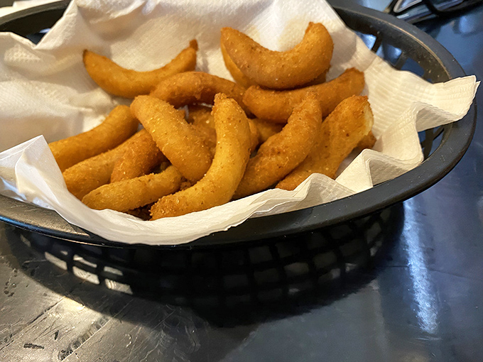 Golden-brown hush puppies that crackle with each bite &ndash; these aren't just side dishes, they're the main event's opening act.