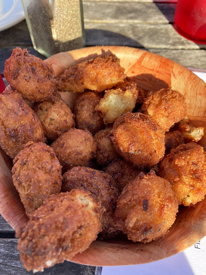 Golden-brown hush puppies that crunch like a perfect vinyl record drop. These Southern delights are the opening act to seafood's main event.