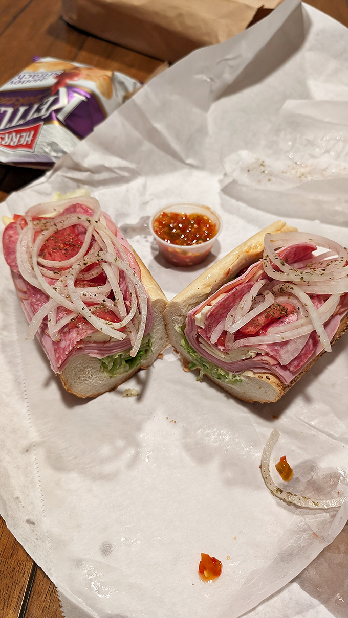 Layer upon layer of Italian cold cuts, a masterpiece of meat architecture. This hoagie doesn't need Instagram filters—it's already perfect.
