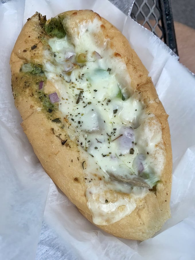 This isn't just melted cheese; it's a spiritual experience on bread. The perfect ratio of herbs, cheese, and bread creates sandwich nirvana.