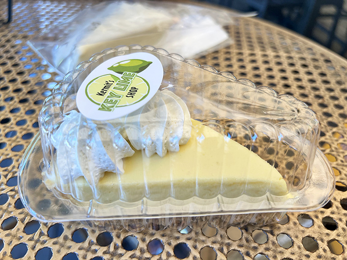 A slice of authentic key lime pie in its natural habitat&mdash;pale yellow, not green, because real key limes know better than to wear costume jewelry to a formal event.