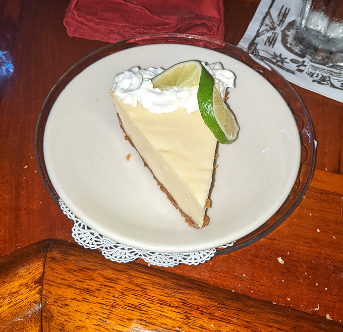 Key lime pie that strikes the perfect balance between tart and sweet, topped with a lime slice that's practically winking at you.