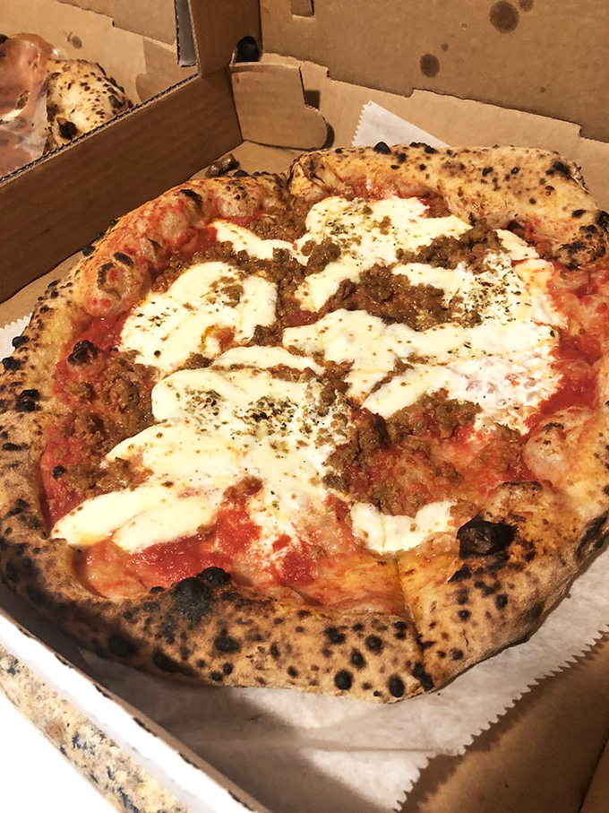 The legendary lasagna pizza in all its glory—where two Italian classics had a delicious love child. Those dollops of ricotta and seasoned beef are practically winking at you.