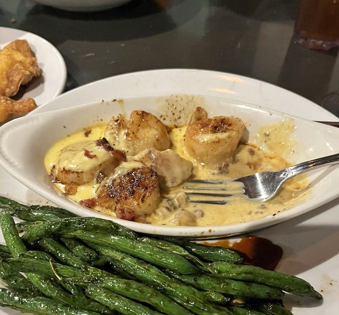 These scallops aren't just cooked&mdash;they're transformed into buttery golden treasures swimming in a sauce you'll want to bottle and take home.