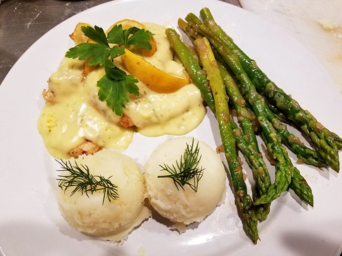Comfort food gets dressed up for a night out. The lemon chicken paired with those perfectly formed mashed potato scoops and fresh dill could make a grown person cry tears of pure joy.