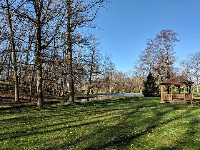 Nature and civilization strike a perfect balance at this peaceful park, where a gazebo waits patiently for the next family gathering.