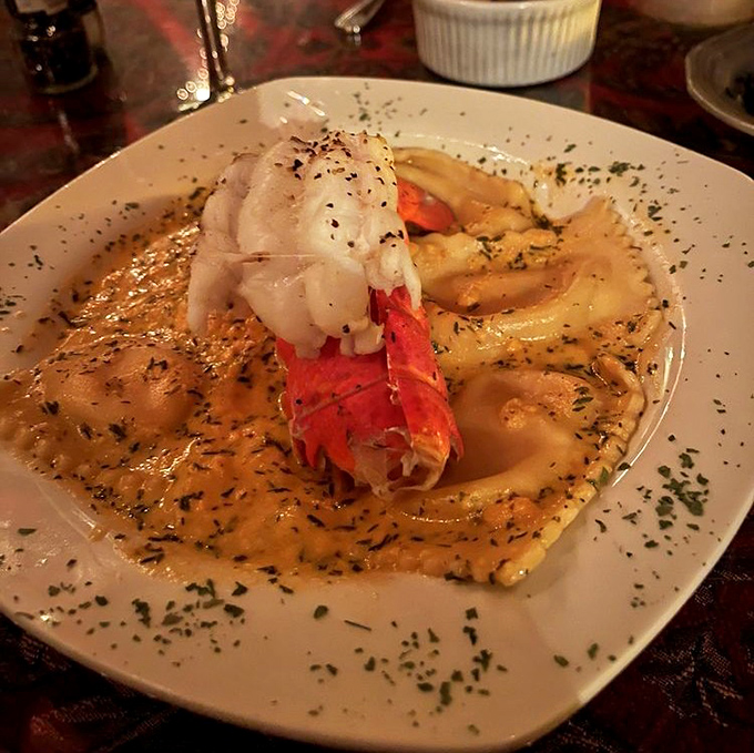 Lobster Ravioli arrives like edible poetry, proving elegance thrives in underground dining chambers.