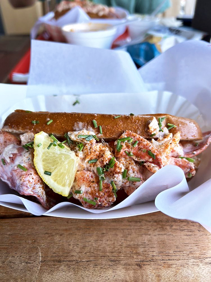 This isn't just any lobster roll; it's the kind that makes you question why you've wasted time eating anything else.