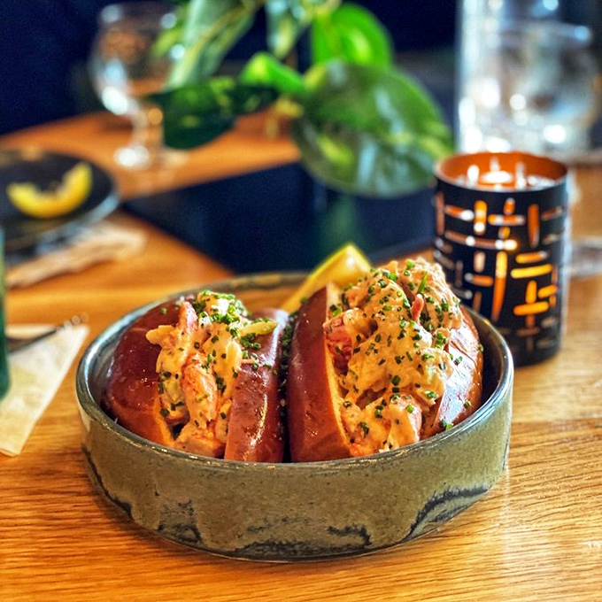 These aren't your childhood hot dogs. Perfectly toasted buns cradle what appears to be lobster or seafood filling, proving that playground food has seriously grown up.