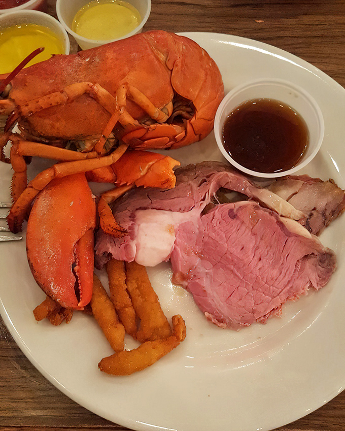 A plate that answers life's eternal question: "Why choose?" Succulent lobster and prime rib sharing real estate in perfect harmony.