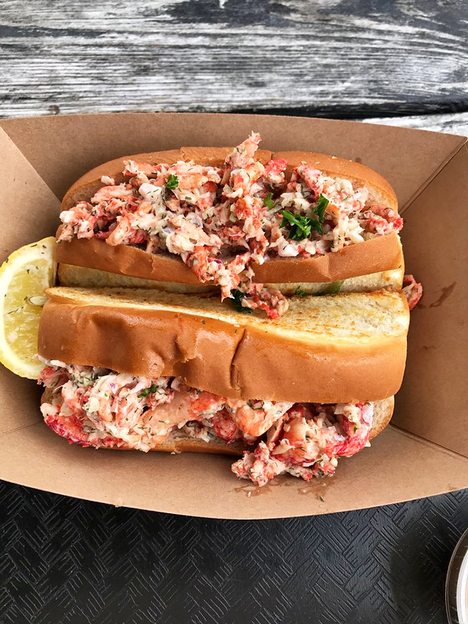 The star of the show: chunks of sweet lobster meat nestled in a perfectly toasted roll. This isn't just a sandwich; it's a New England vacation in handheld form.
