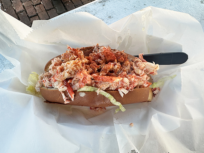 This lobster roll is piled so high, it's practically defying gravity and definitely defying your diet plans.