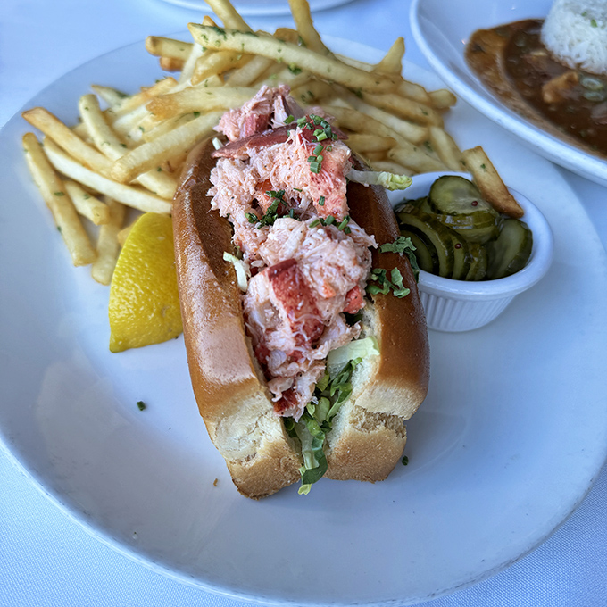 Behold the lobster roll that launched a thousand return visits &ndash; pure Maine-style perfection nestled in buttery bread bliss.