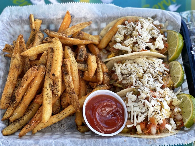 These tacos don't need a fancy introduction &ndash; just fresh fish, simple toppings, and fries seasoned to perfection. Vacation on a plate.