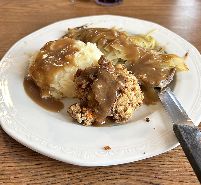 Cloud-like mashed potatoes swimming in savory gravy&mdash;proof that sometimes the simplest foods deliver the most profound joy.
