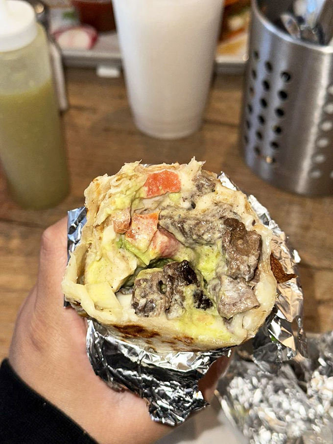 This burrito isn't just a meal, it's an architectural achievement that would make Frank Lloyd Wright weep with joy.