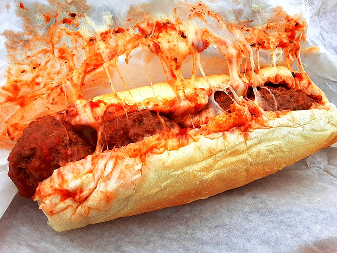 Behold the sandwich that launched a thousand napkins. Melted cheese stretches like it's auditioning for a pizza commercial.