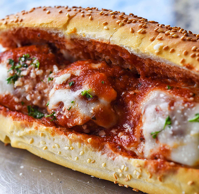 Behold the star of our show: the meatball sub in all its saucy, cheesy glory. This isn't just lunch&mdash;it's a religious experience with melted mozzarella.